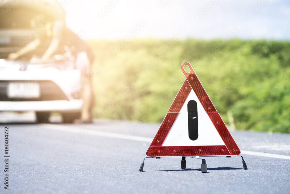 Emergency stop sign and man with broken car Stock Photo | Adobe Stock
