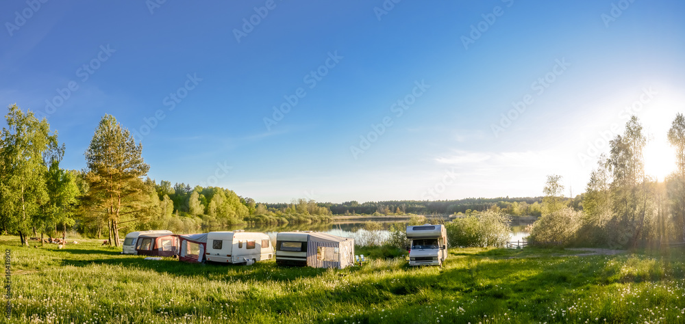 Caravans and camping on the lake. Family vacation outdoors, travel ...