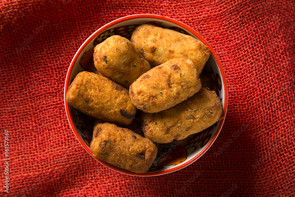 Cod fritters, traditional Spanish tapas Bunuelos de Bacalao Stock Photo ...