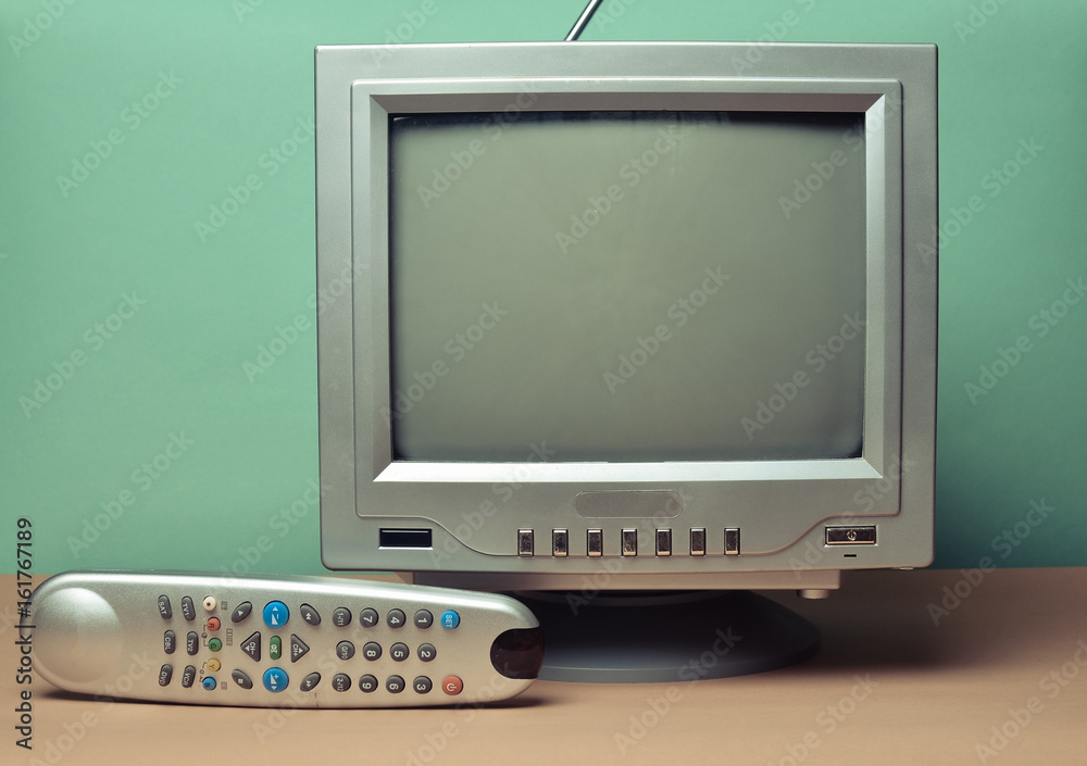 Vintage TV from 80s, remote control on a pastel background ...