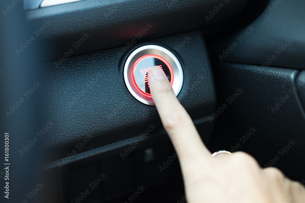 hand of woman using finger for press start engine button with light and ...