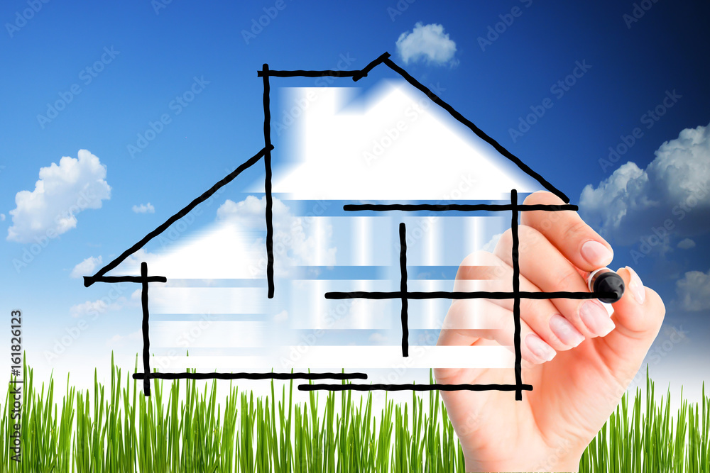 House design or build your own house with woman hand drawing against ...