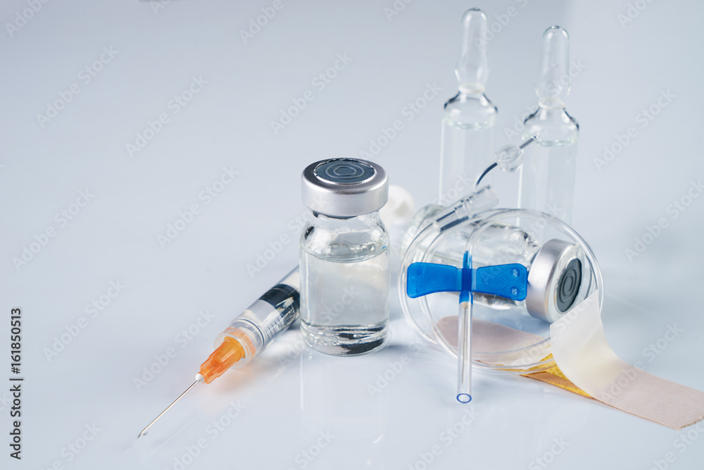 Medical ampoules, infusion and syringe with injection isolated on white ...
