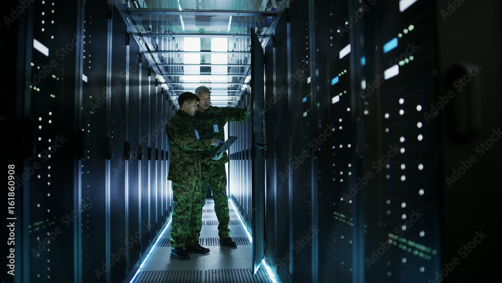 In Data Center Two Military Men Work with Open Server Rack Cabinet. One ...