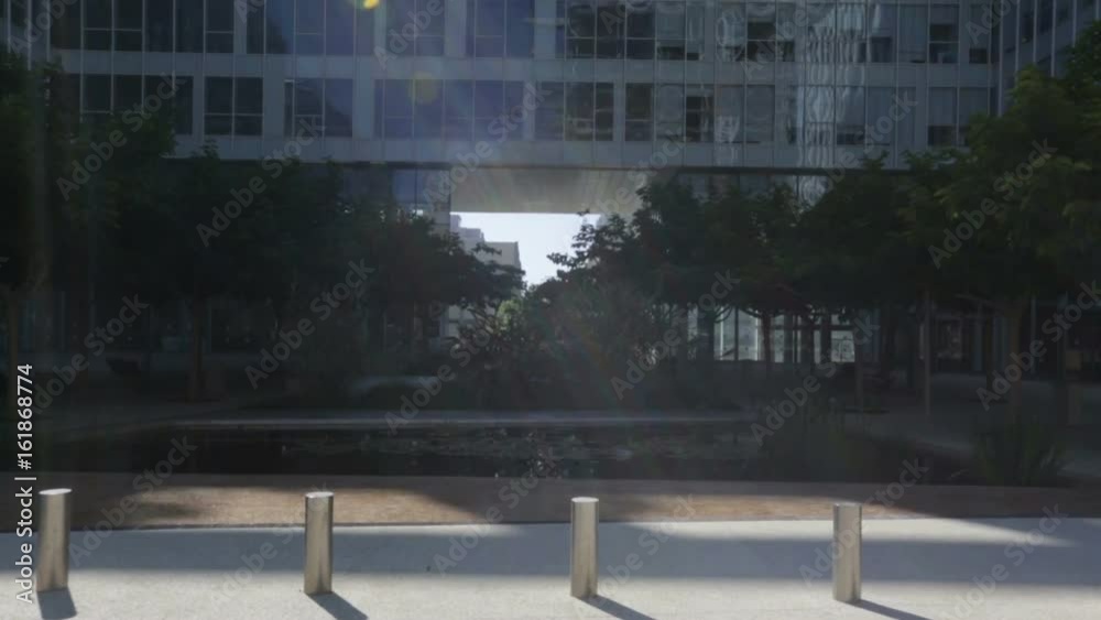 day Up angle Tilt up over modern tall large glass high rise office ...