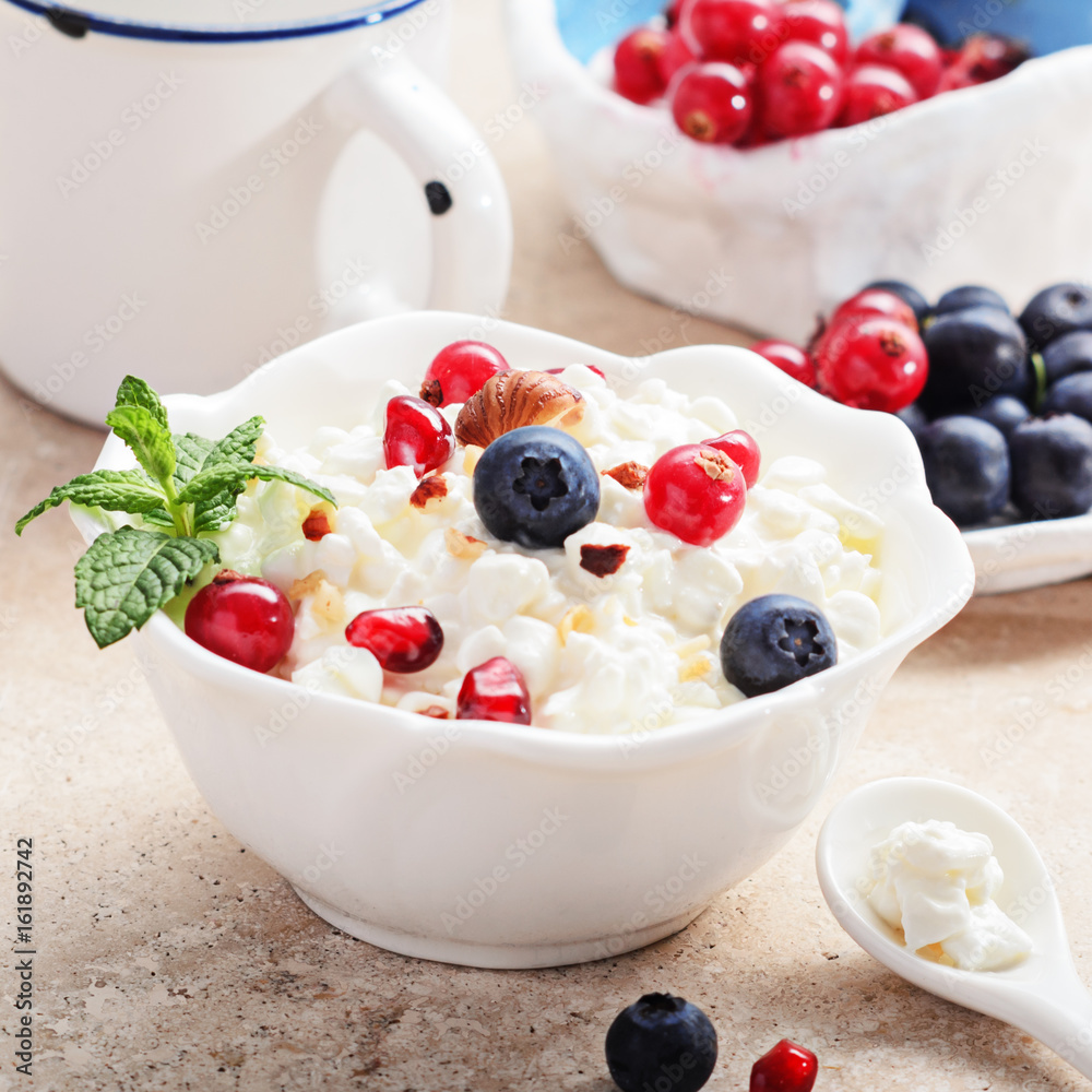 Cottage cheese with berries on light background. Close up. Stock Photo ...