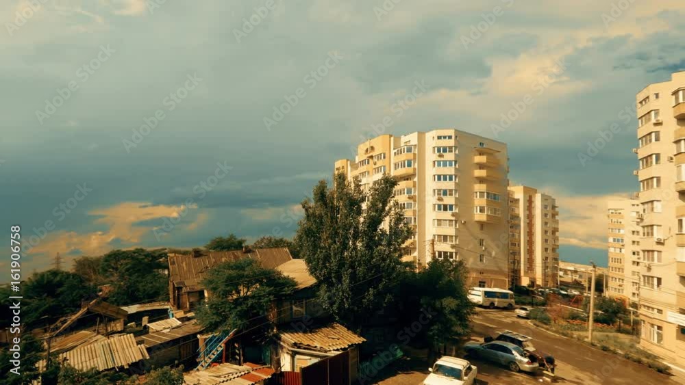 Sky and clouds fly over slum houses and apartment buildings Stock ビデオ ...