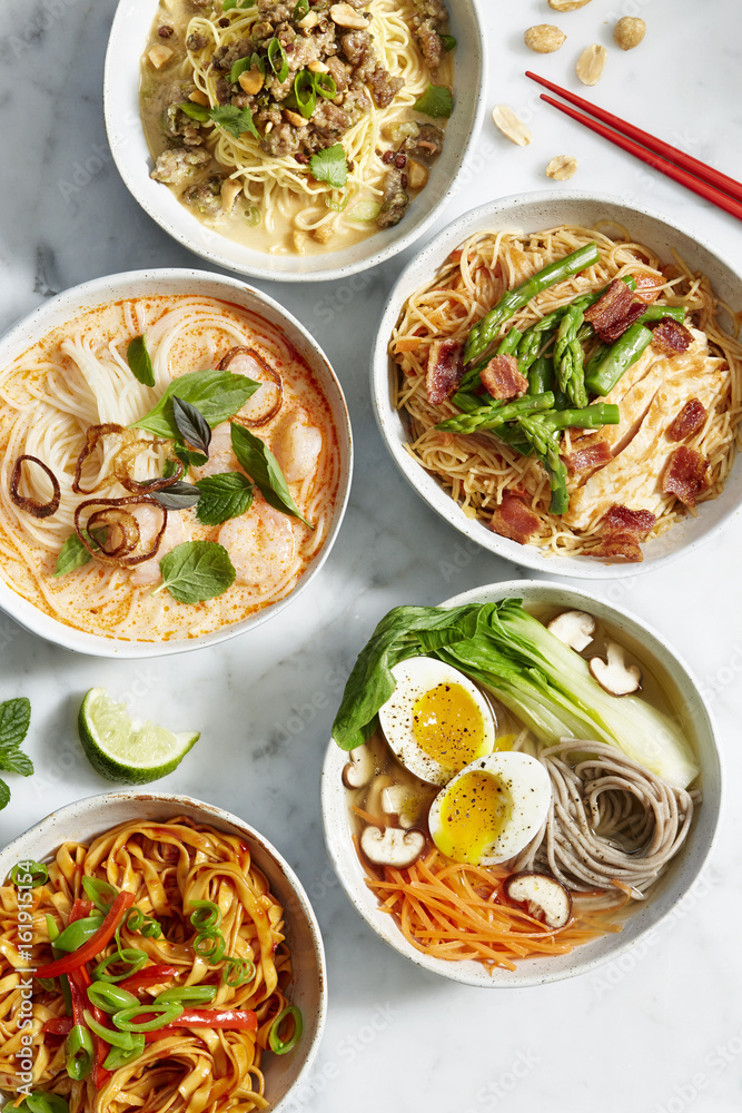 Bowls of different noodle dishes Stock Photo | Adobe Stock