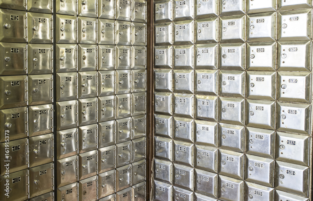 Corner full of rows of metal post office boxes Stock Photo | Adobe Stock