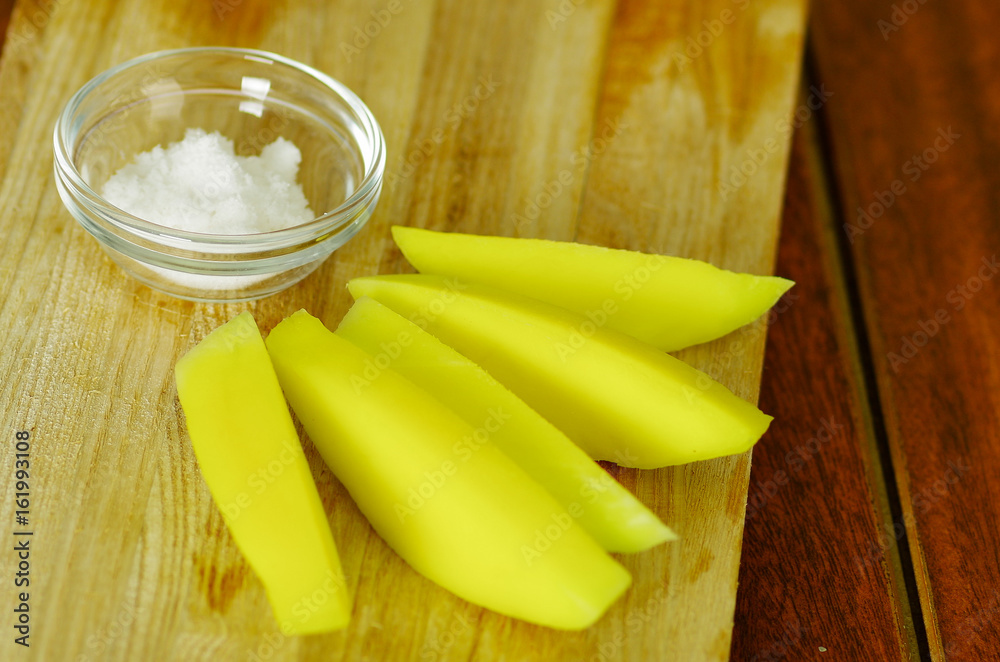 Sliced mango served with salt Stock Photo | Adobe Stock