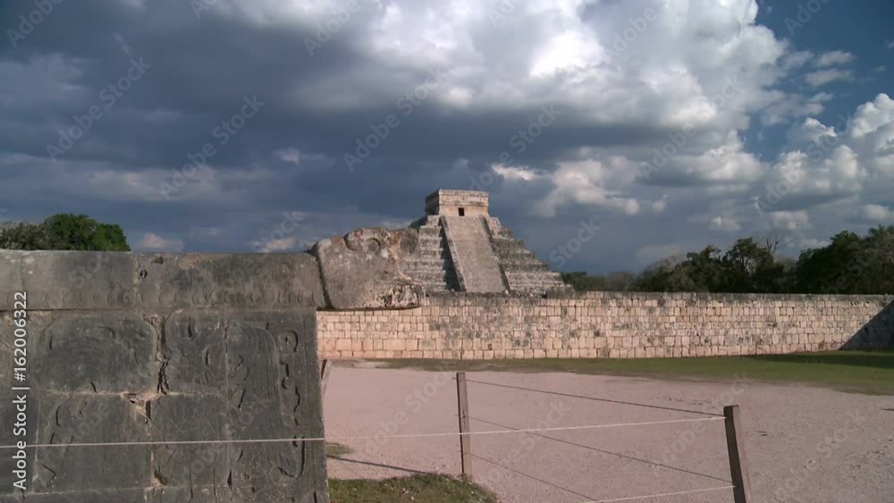 Excavation of the ancient Mayan pyramids of Chichen Itza. Dolly shot of ...
