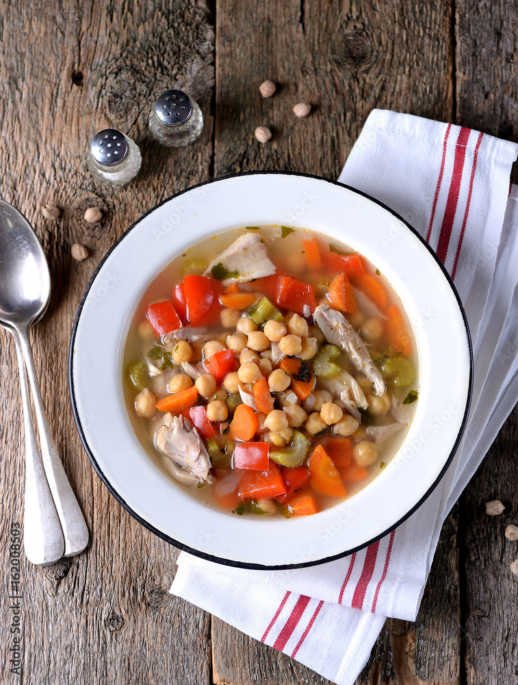 Soup with chicken, chickpeas, sweet peppers, onions, carrots, celery ...