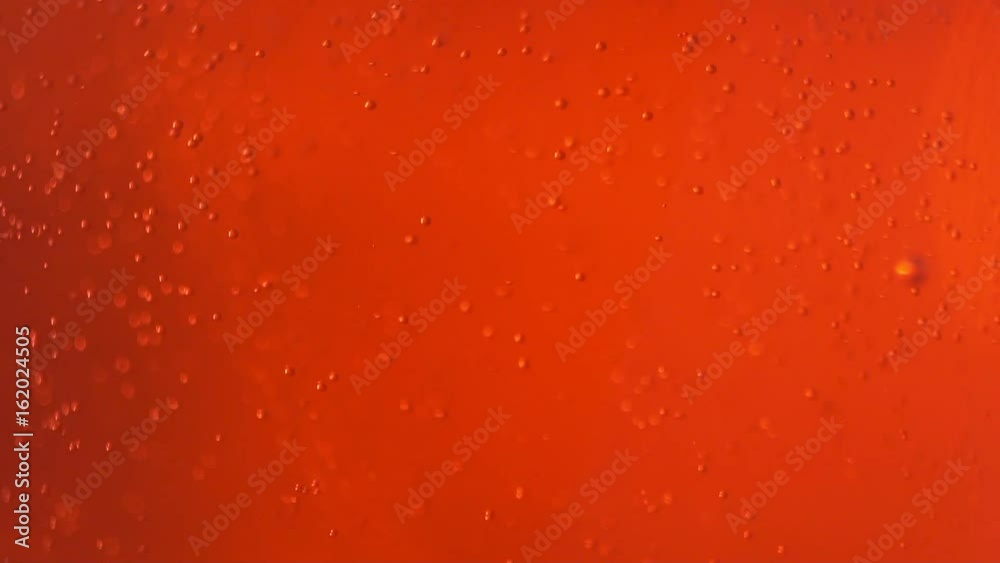 Red liquid in a glass chemical flask: the texture and processes of the ...