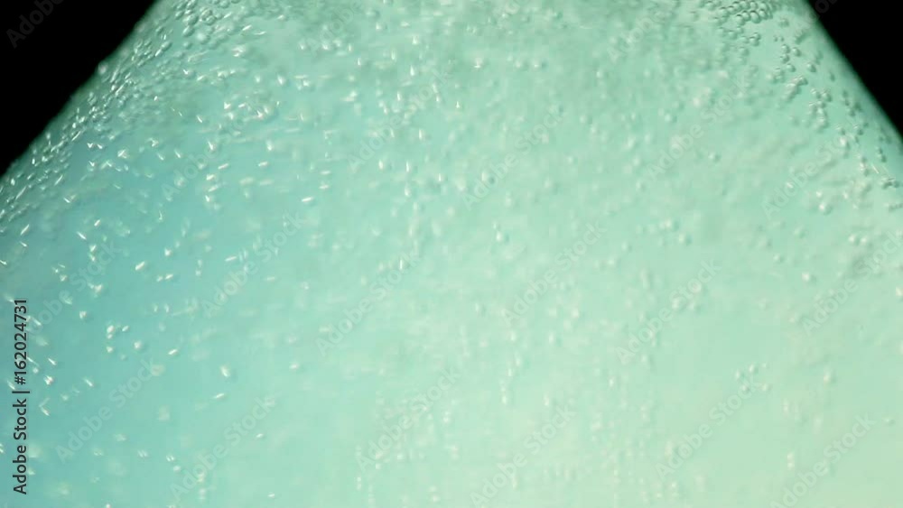 The liquid is turbid white in the glass chemical flask: the texture and ...