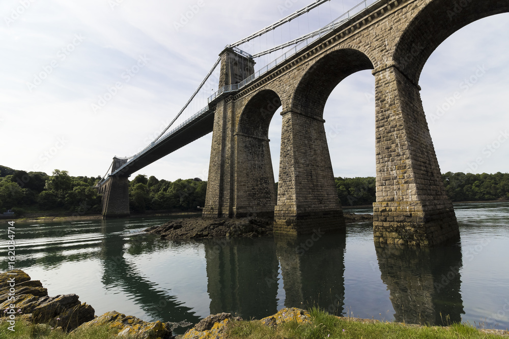 Grand view of the historic Menai Suspension Bridge spanning the Menai ...