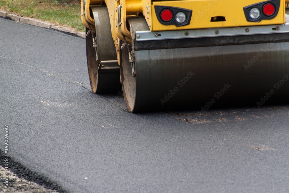 New asphalt road. Road asphalt works. Construction works. Stock Photo ...
