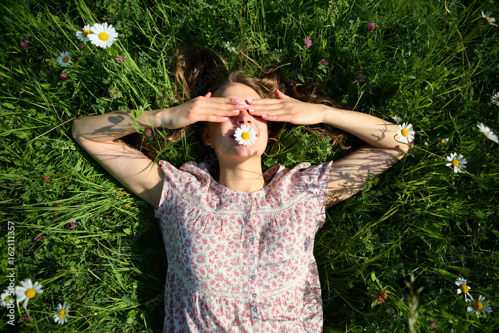 Summer Funny Young Beautiful Woman Lying On Grass In Green Field In