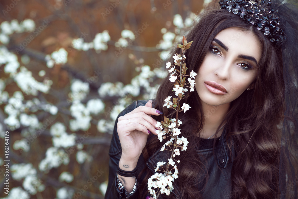 Close up portrait of a beautiful sad dark-haired young woman with ...