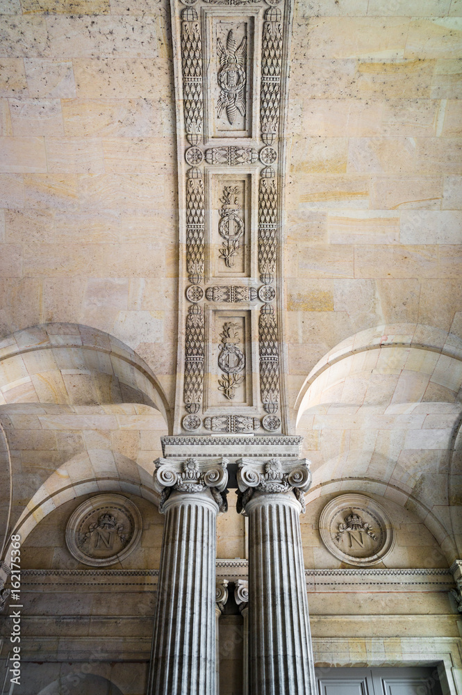 Cross-vaulted ceiling with sculpted columns and Napoleon emblem. Stock ...