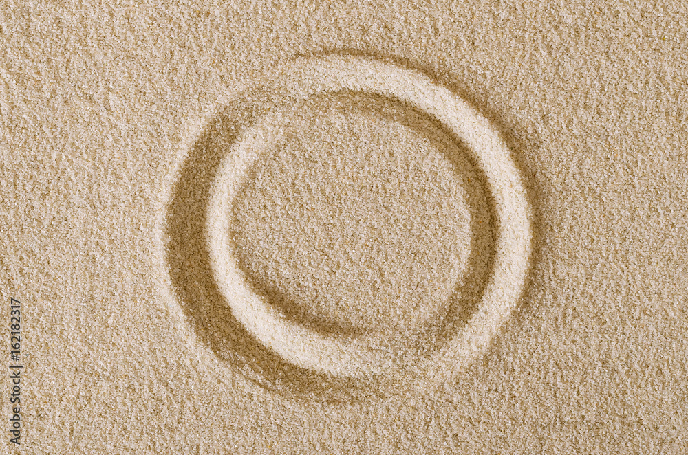 Circle shape imprint in sand surface. A closed curve, a ring or a disc ...