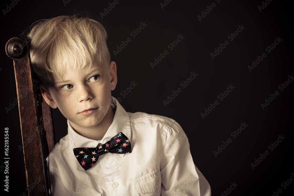 Introvert withdrawn little blond boy Stock Photo | Adobe Stock