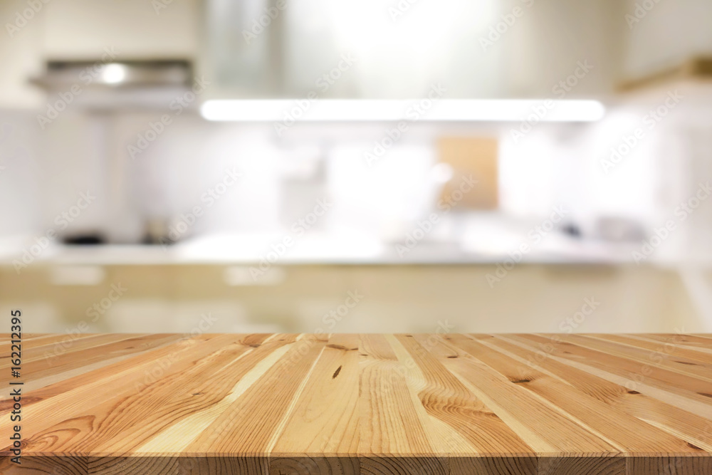 Natural pattern wood table top (or kitchen island) on blur kitchen ...