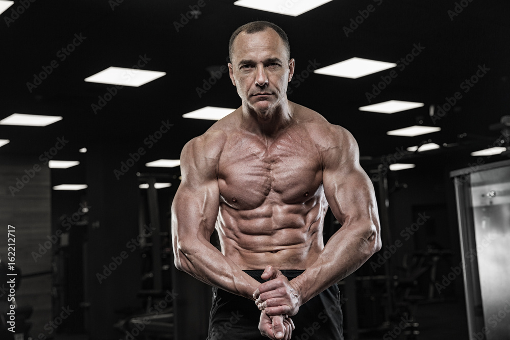 Brutal bodybuilder athletic man with six pack, perfect abs, shoulders ...