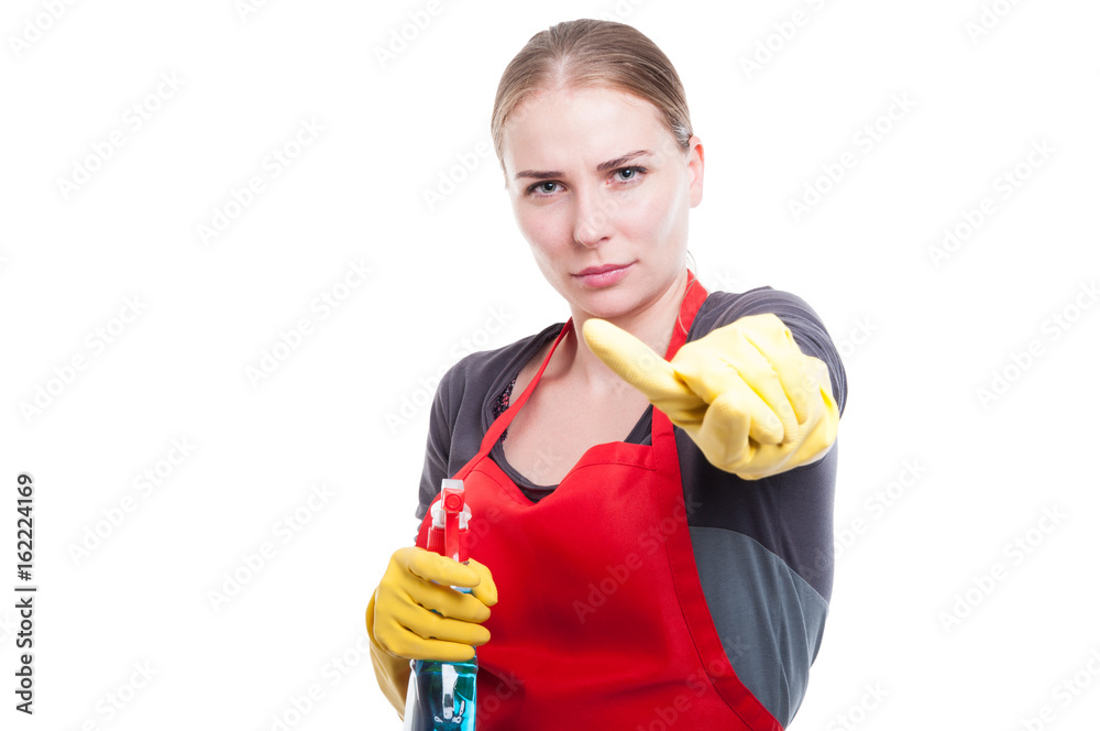 Serious maid with cleaning spray doing no sign Stock Photo | Adobe Stock