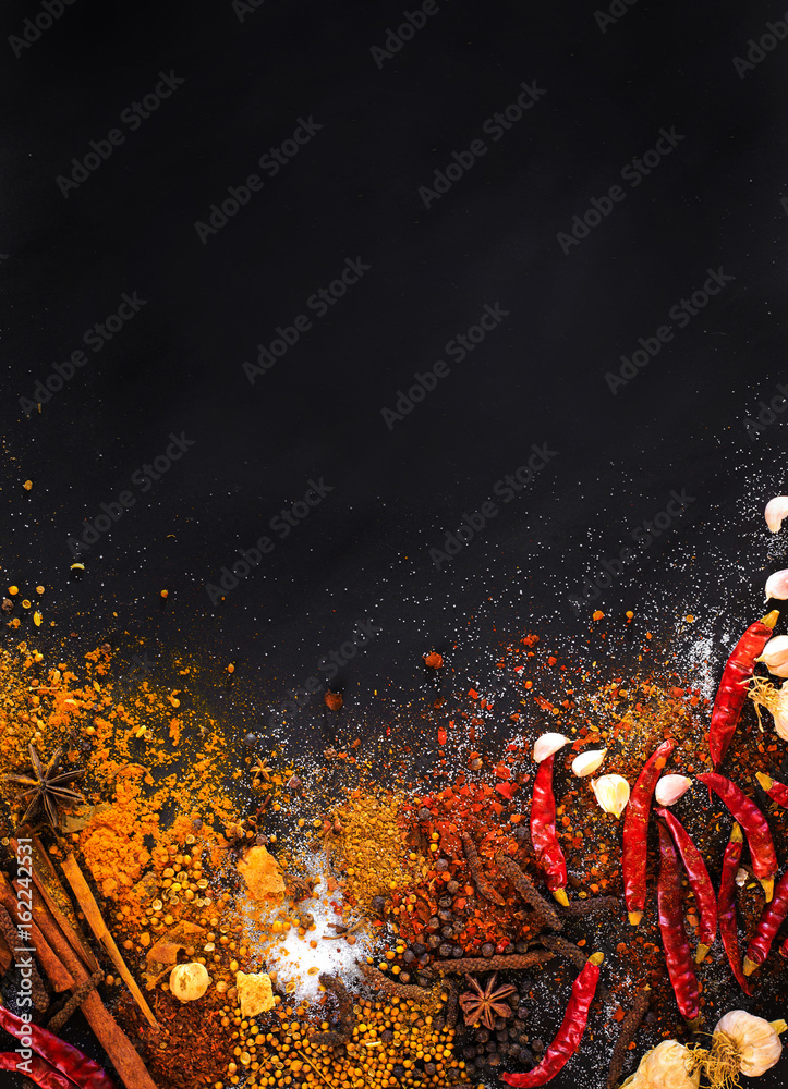 Variety Spices and herbs on black stone background, Top view with empty ...