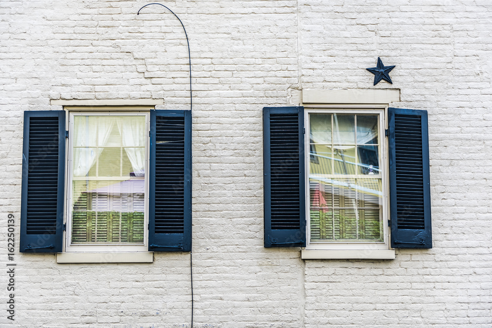 Residential home windows with white brick architecture and star Stock ...