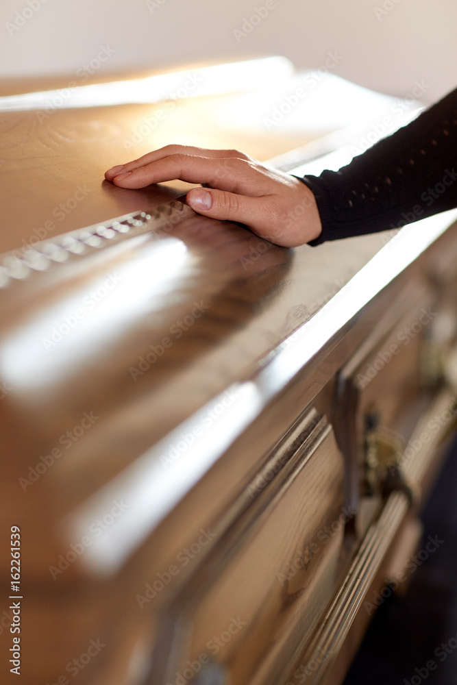 woman hand on coffin lid at funeral in church Stock Photo | Adobe Stock