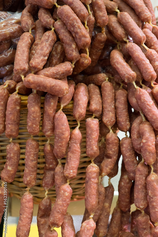 Food plat with delicious salami, pieces of sliced ham, sausage, cooked ...