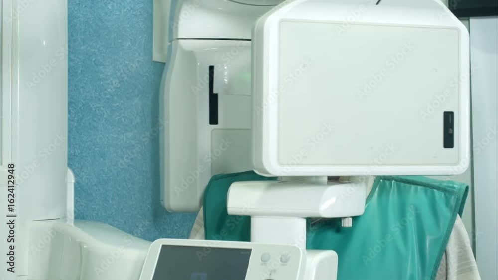 Senior patient doing examination of teeth by using panoramic and ...