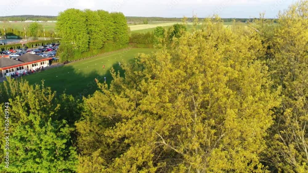Aerial of soccer field also known as football field first flying behind ...