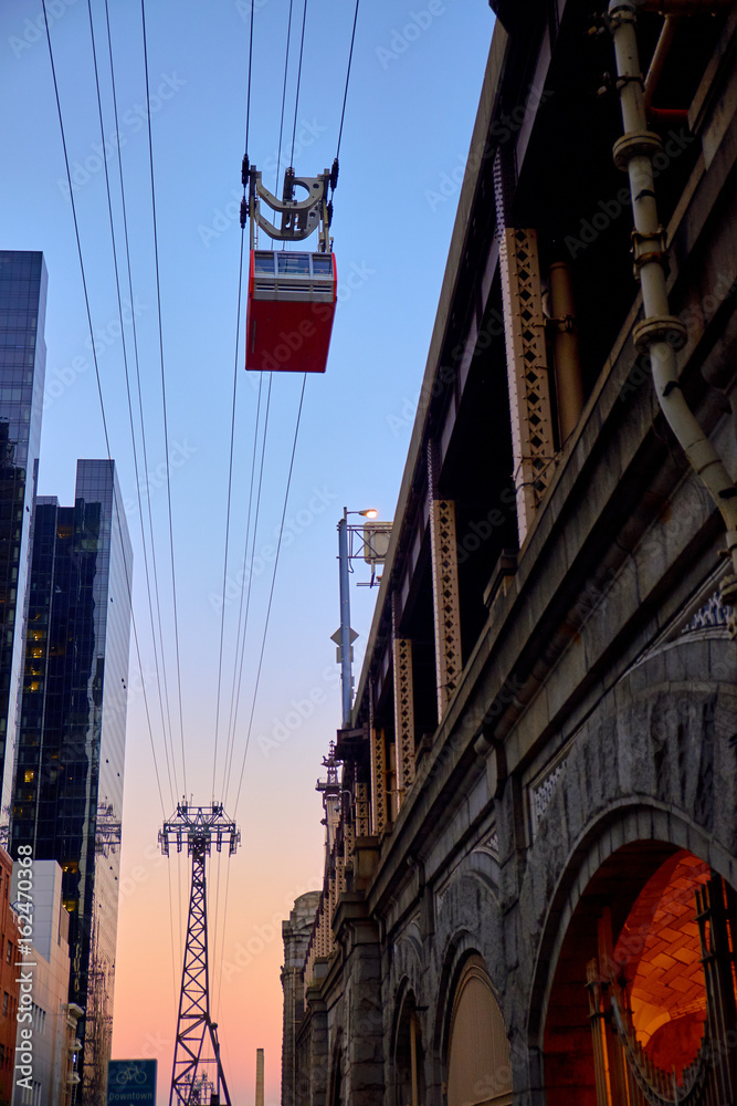 Poster The Roosevelt Island cable car hovering over 60th Street and ...