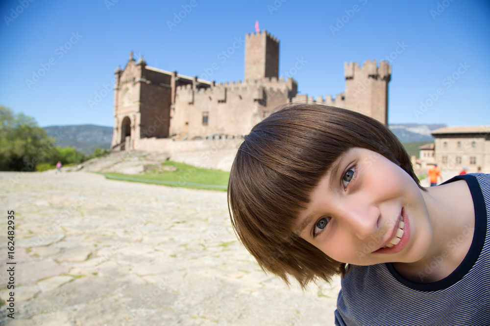 Young boy posing and smiling over ancient spanish castle Javier ...