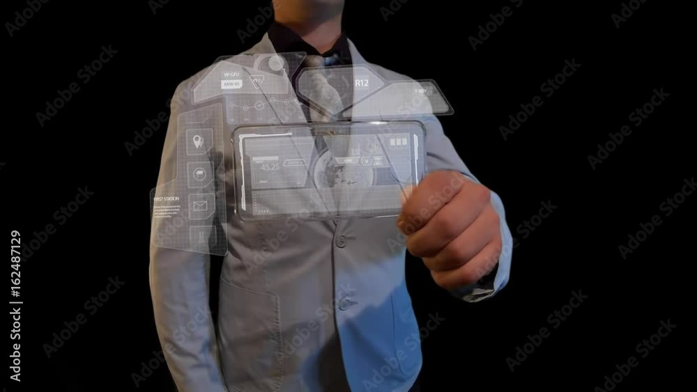 Man with a futuristic screen. The concept of the future interface on a ...