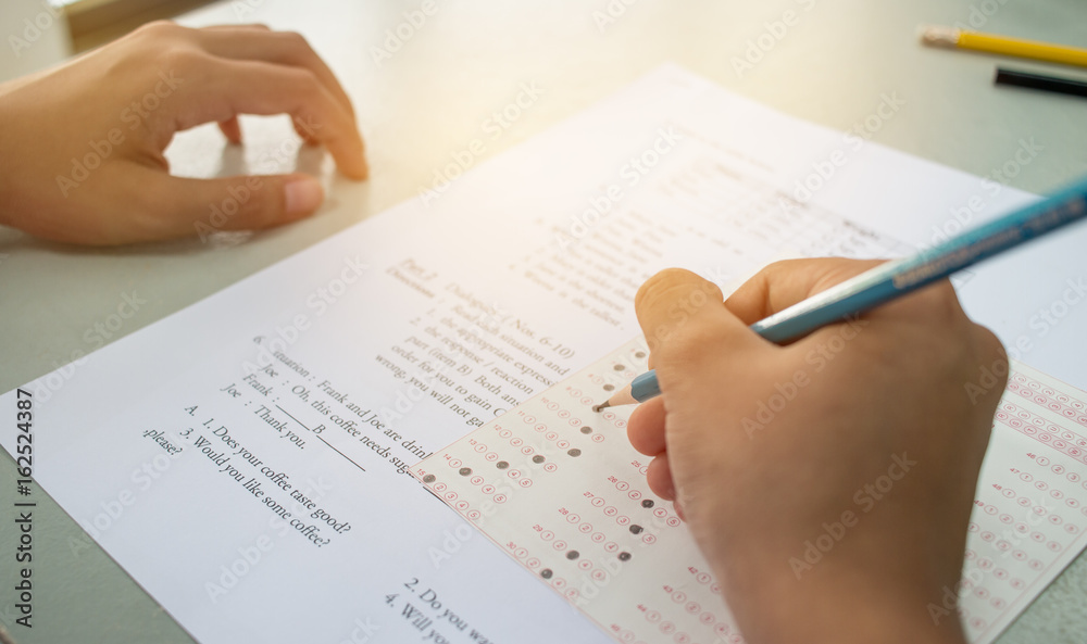 Asian student testing english exam or exercise on exams answer sheets ...