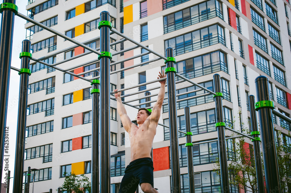 Handsome sexy male bodybuilder athlete man doing crossfit workout in ...