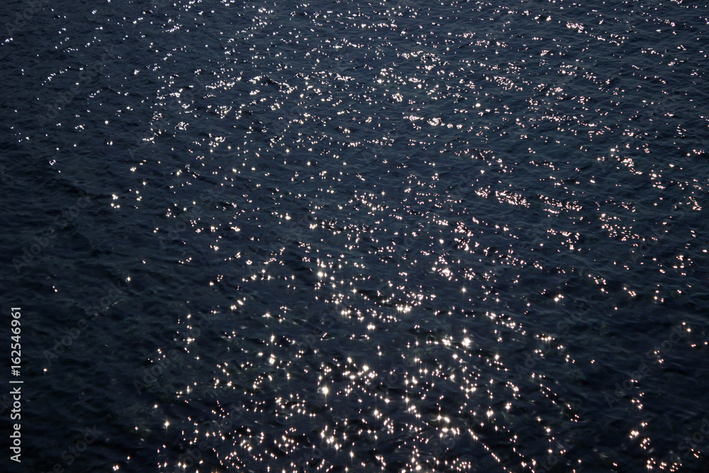 Dark blue water, a sea under sun rays background Stock Photo | Adobe Stock