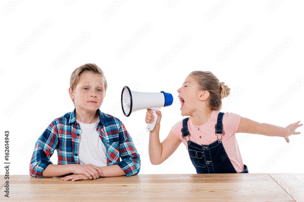 angry girl with megaphone yelling on her brother isolated on white ...