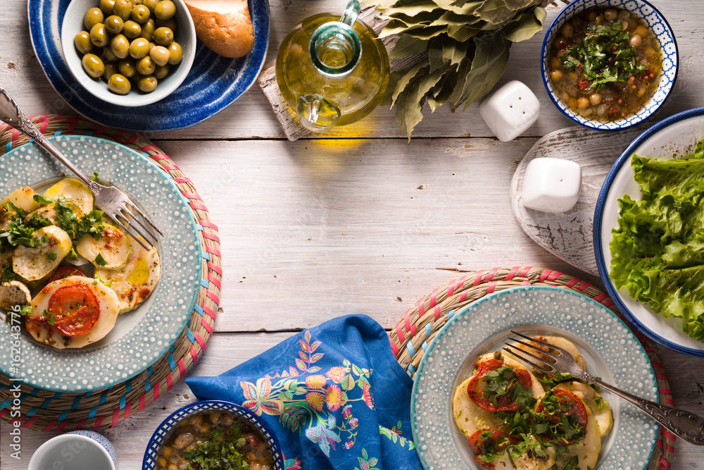 Traditional Greek dishes Brian and Revithia on the white wooden table ...