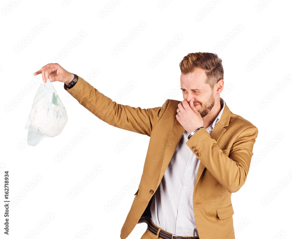 man holding dirty dirty diaper in one hand fingers over black ...