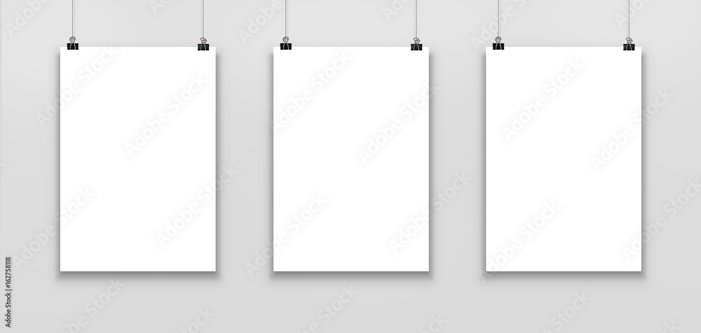 Three blank paper poster mockup isolated on a gray background. Stock ...