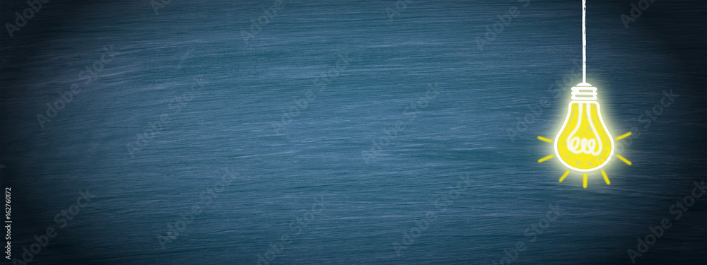 Light bulb on blue chalkboard background - copy space for individual ...
