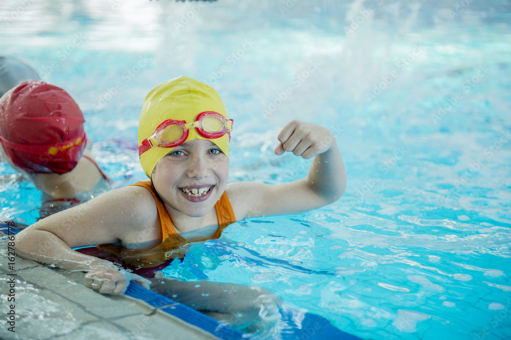 happy children kids group at swimming pool class learning to swim Stock ...
