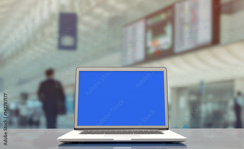 empty blue screen monitor of laptop with blurred business hour of ...