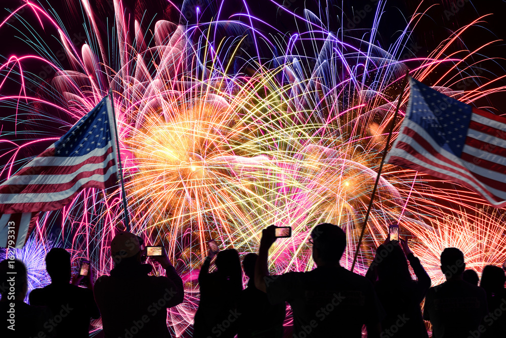 People Watching Fireworks Display with Flags Stock Photo | Adobe Stock