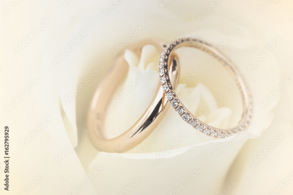 Soft blurred of wedding ring on a rose pastel color style background ...