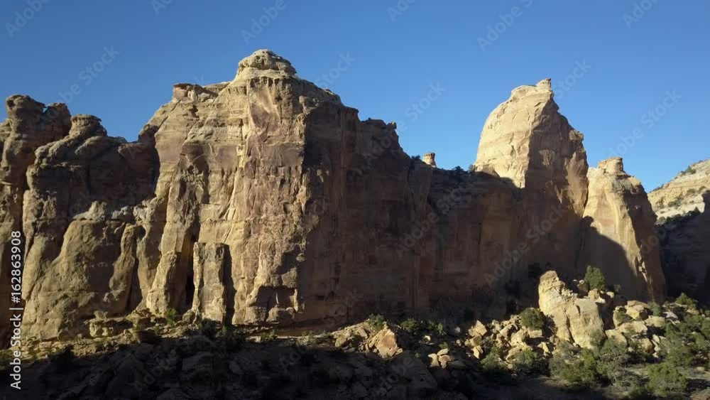 Aerial slide Eagle Canyon Arch sheer cliff valley Utah reveal part 2 ...